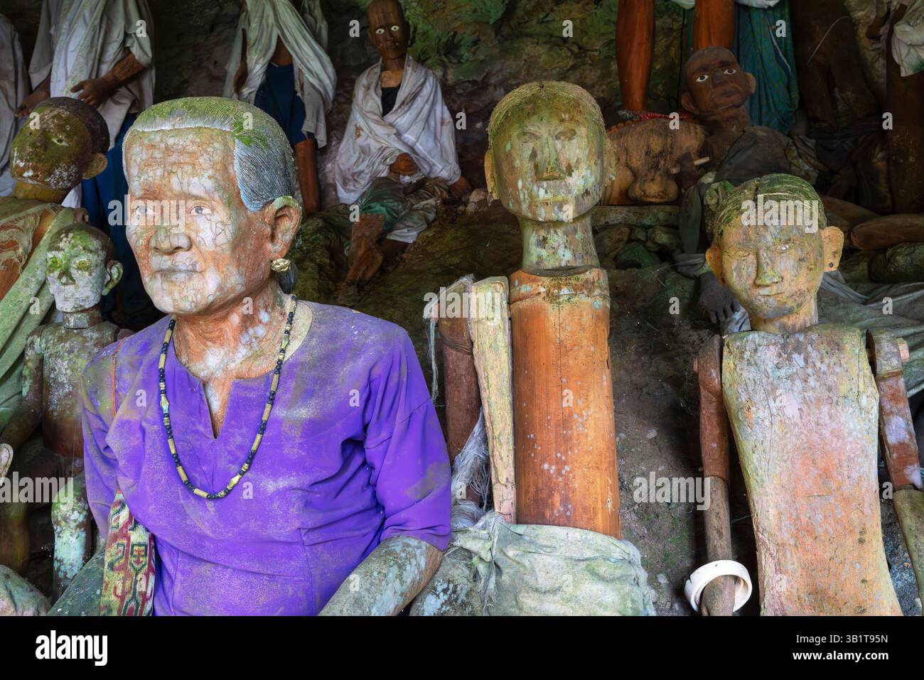 Old tau-tau effigies placed in cave, used for burial. Traditional ...