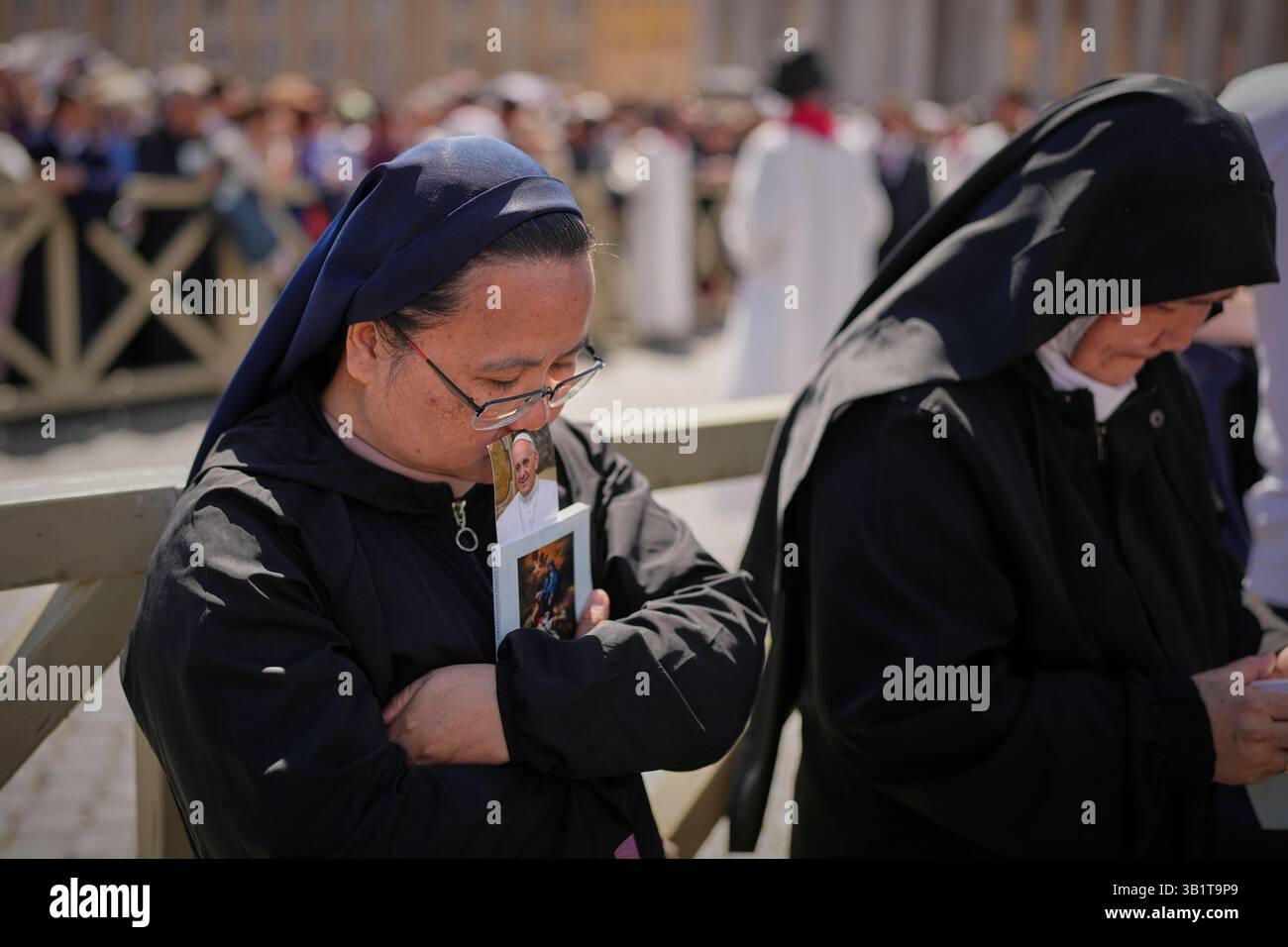 Nuns attend the funeral of Pope Francis in St. Peter's Square at the ...