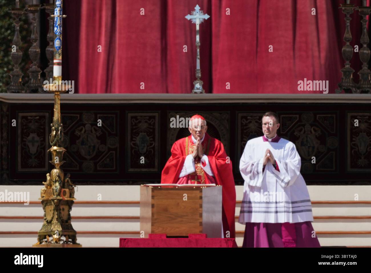 Dean of the College of Cardinals Giovanni Battista Re, center, presides ...