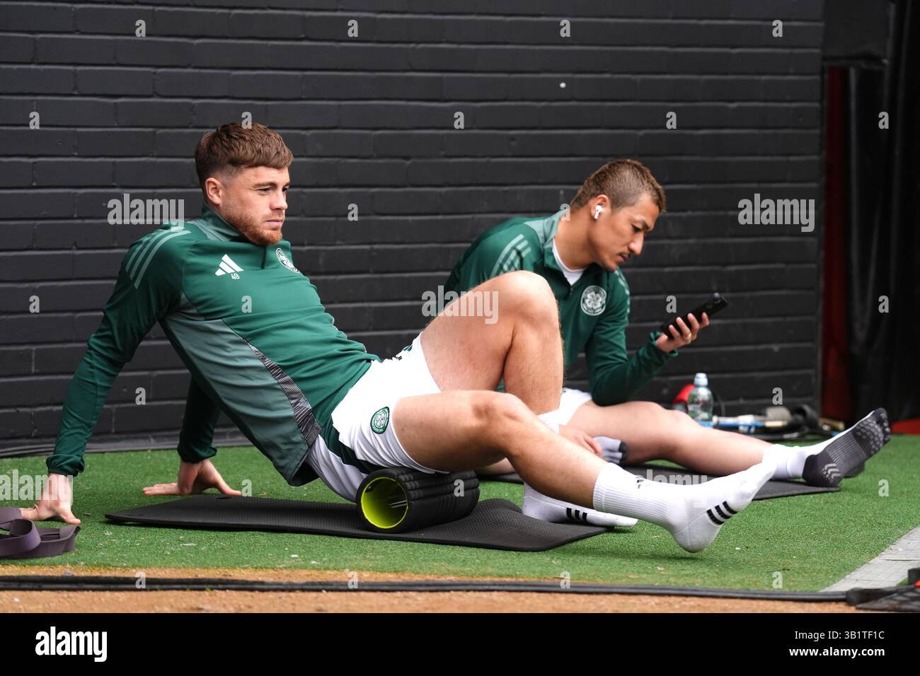 Celtic's James Forrest (left) and Daizen Maeda warming up prior to kick ...