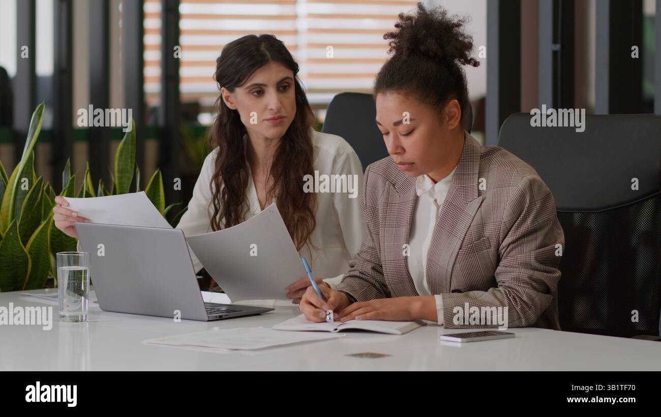 Multiethnic businesswomen two coworkers business partners multiracial ...