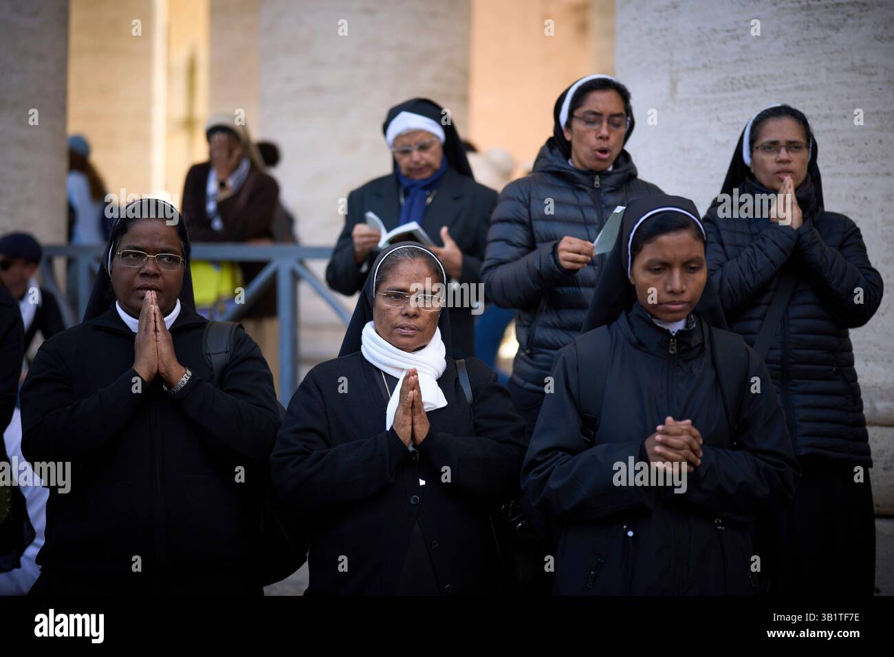 Nuns pray during the funeral of Pope Francis in St. Peter's Square at ...