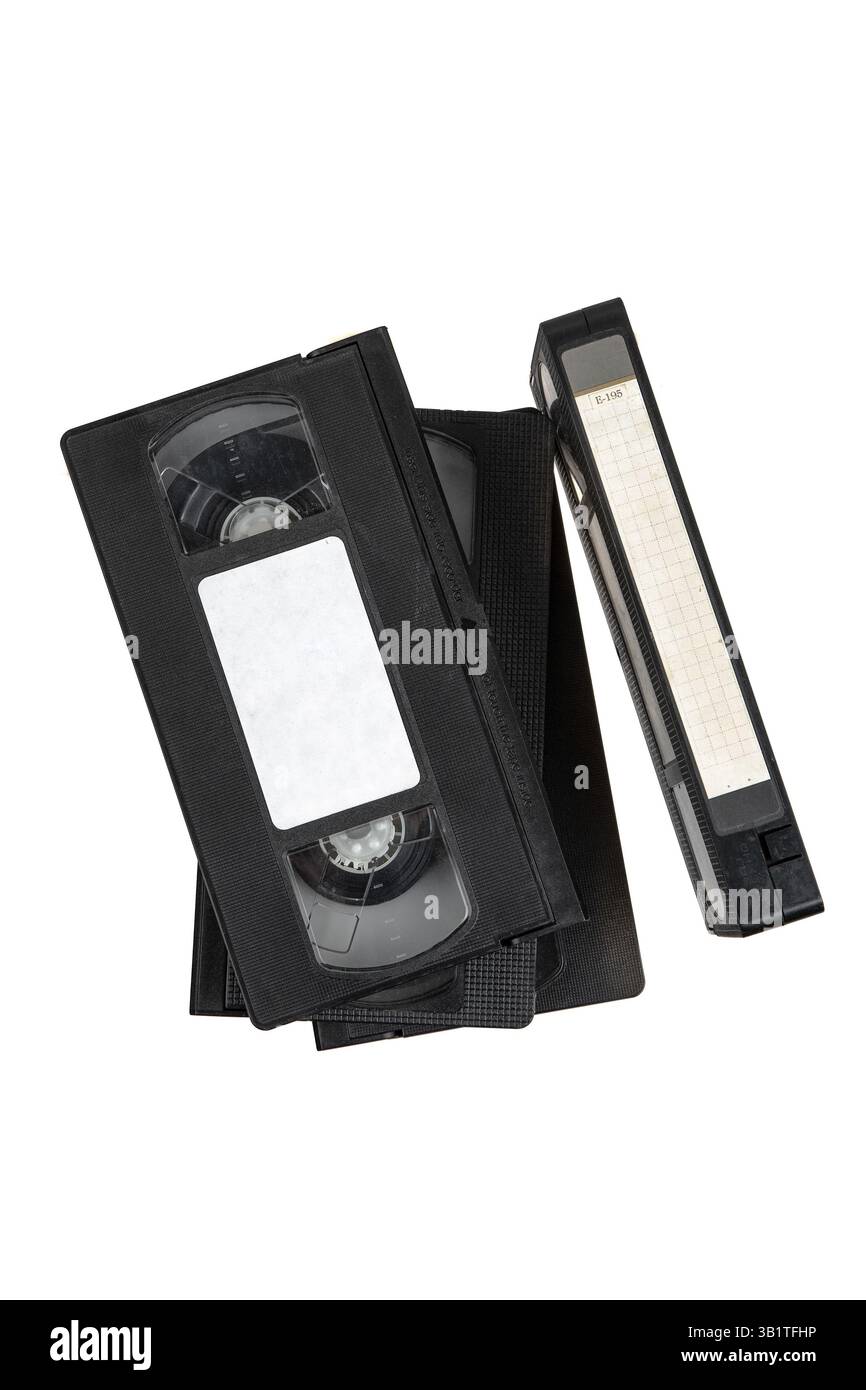 A collection of old black VHS video cassettes stacked together, retro ...