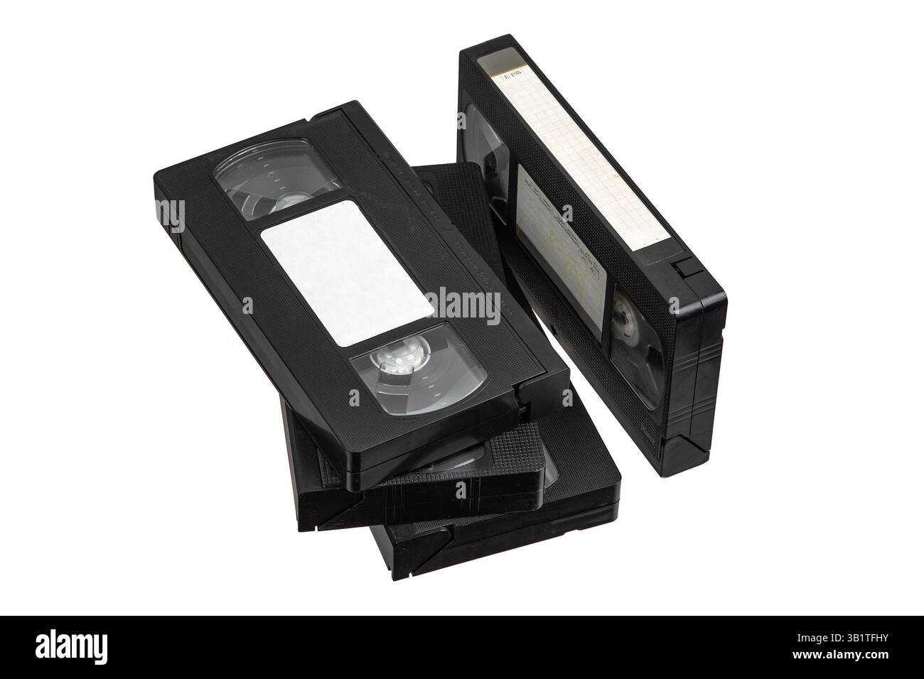 A collection of old black VHS video cassettes stacked together, retro ...