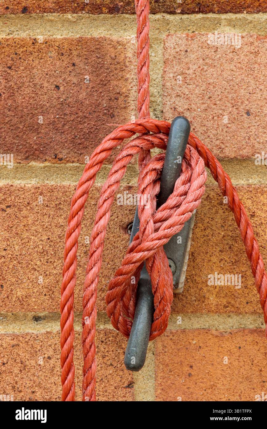 Red nylon washing line on cleat hook hi-res stock photography and ...
