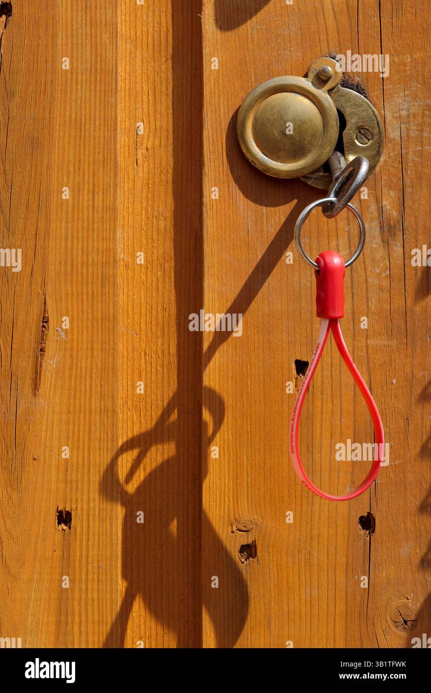 Shadows cast on shed door from lock and key hi-res stock photography ...
