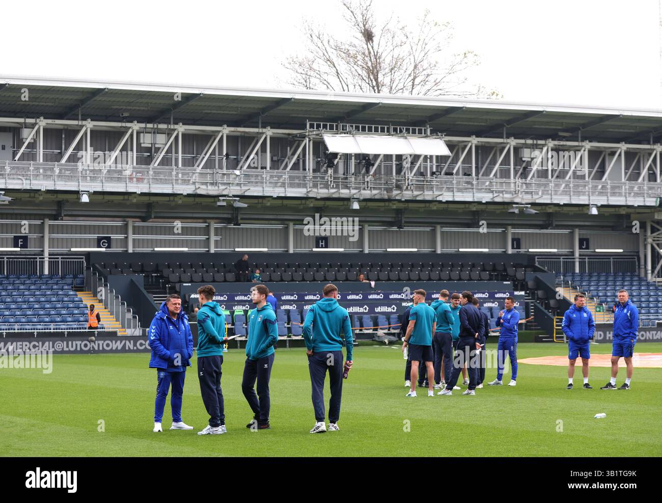 Coventry City players and staff inspect the pitch before the Sky Bet ...