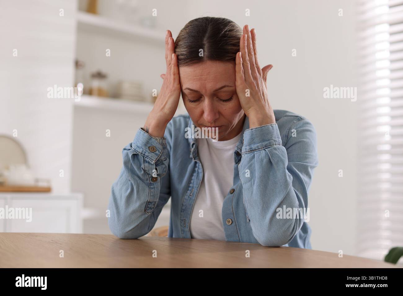 Stressed mature woman crying hi-res stock photography and images - Alamy
