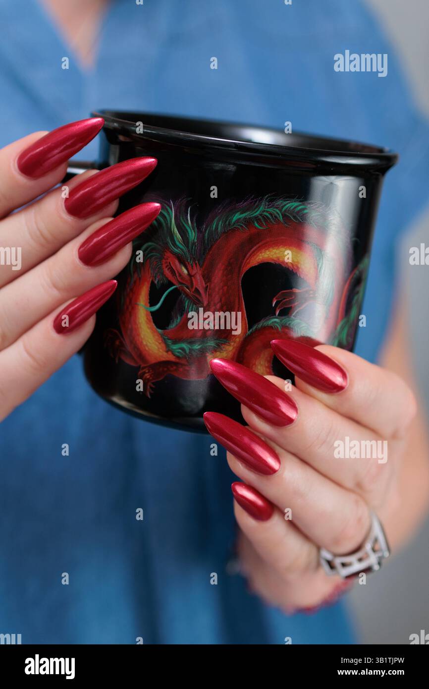 Womens hands red nails hi-res stock photography and images - Alamy