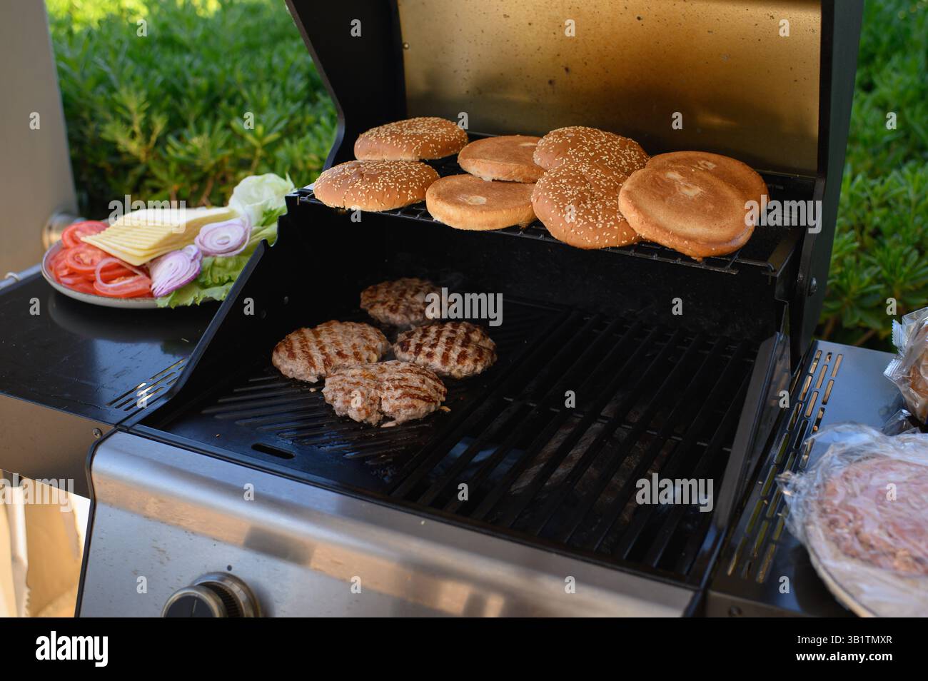 Flipping patties grill hi-res stock photography and images - Alamy