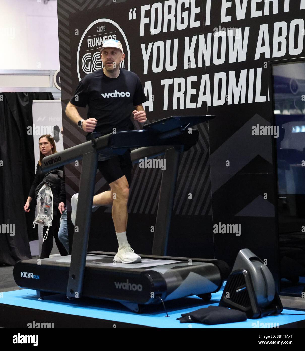 A treadmill and runner at the London Matron Expo at the Excel London ...