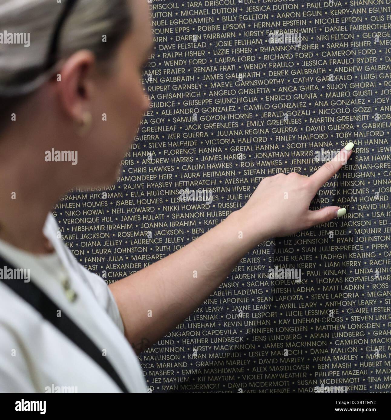 A runner spots her name in the wall of fame at the Excel Runners expo ...