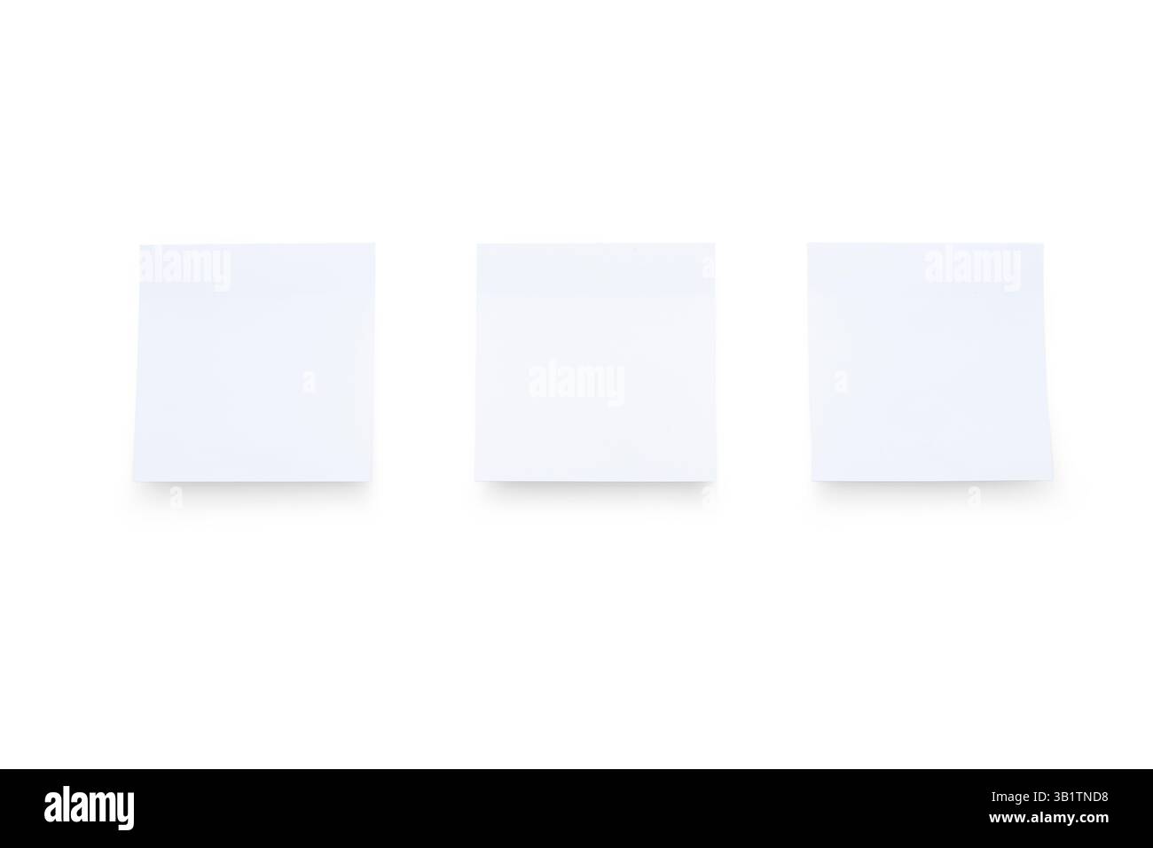White sticky note stickers stuck on white background Stock Photo - Alamy