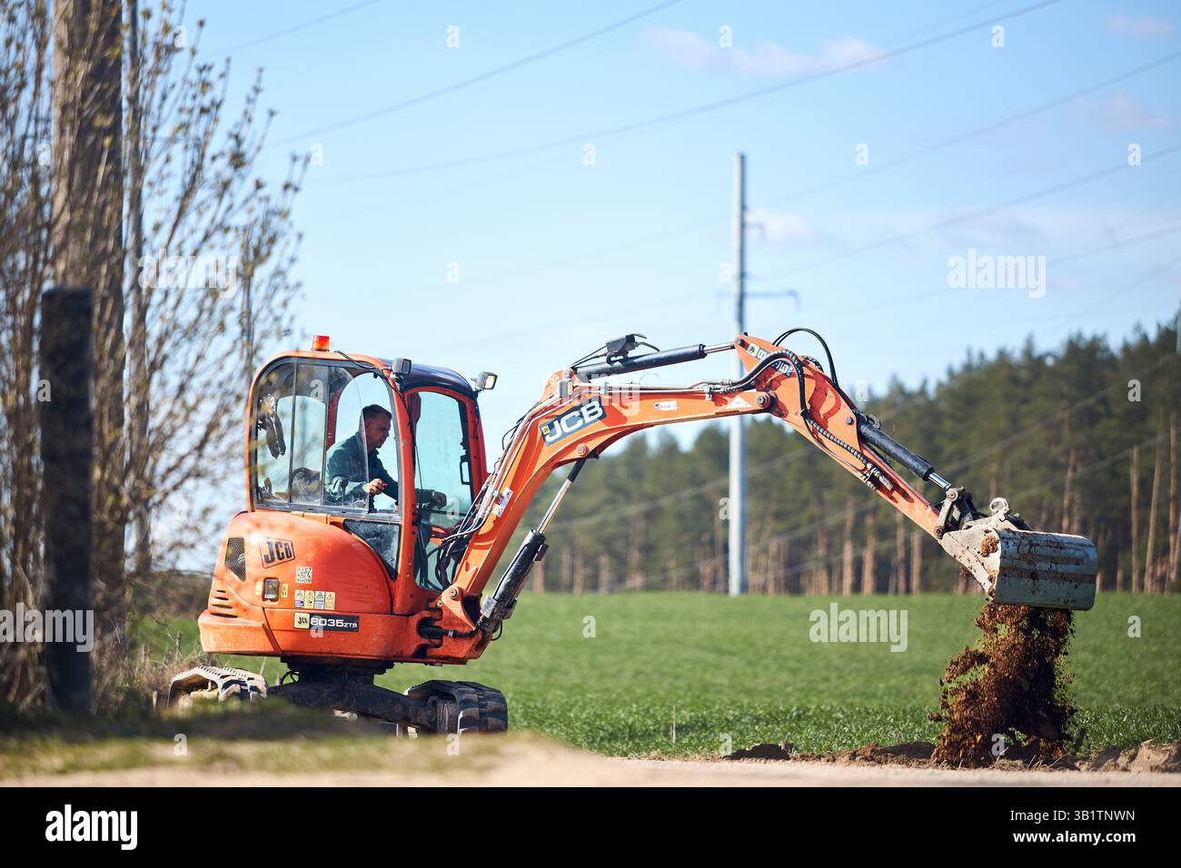Mir, Belarus - April, 7 2025: JCB 8035 ZTS Mini Excavator with worker ...