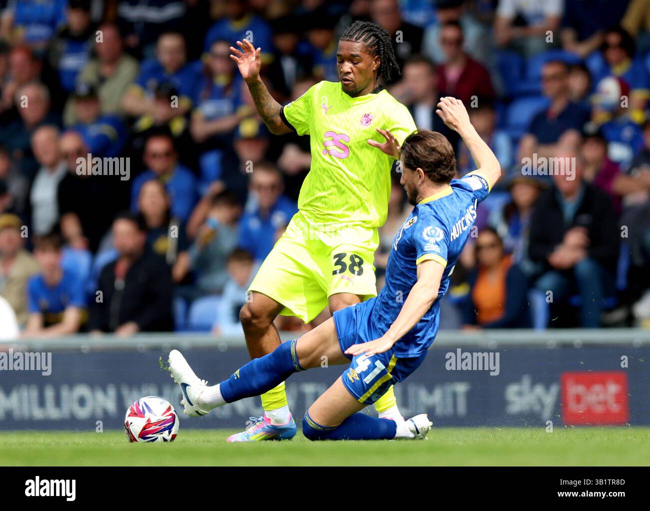 AFC Wimbledon's Sam Hutchinson and Port Vale's Rhys Waters battle for ...