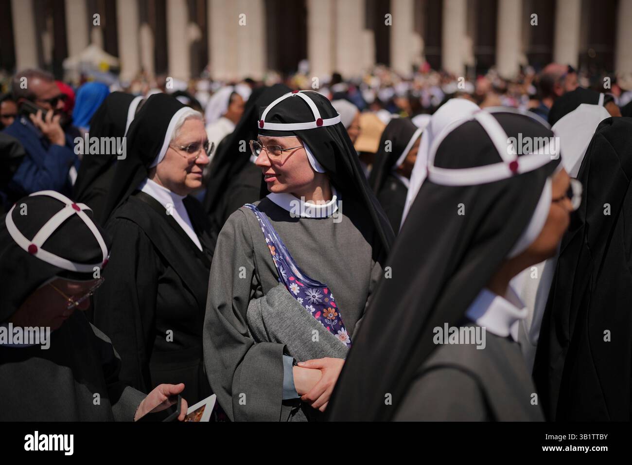 Nuns attend the funeral of Pope Francis in St. Peter's Square at the ...