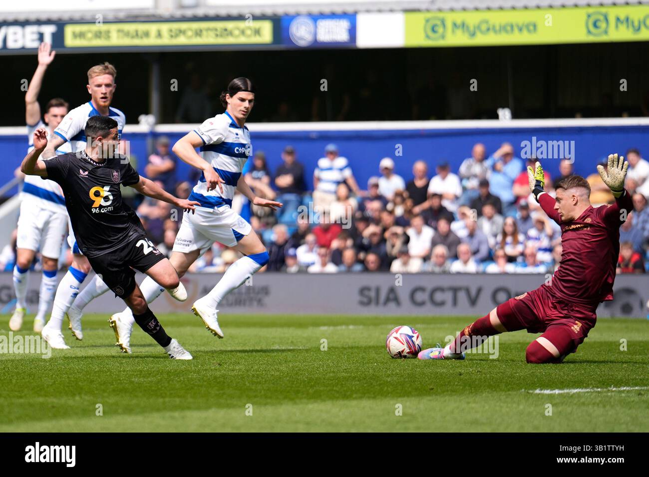 Burnley's Josh Cullen (left) scores their side's first goal of the game ...