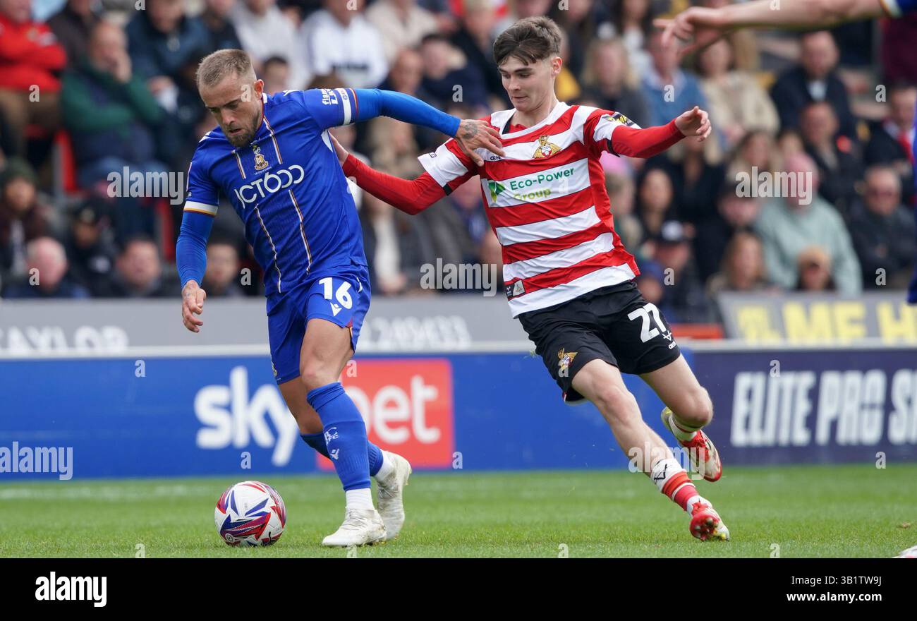 Doncaster Rovers' Charlie Crew against Bradford City's Alex Pattison ...