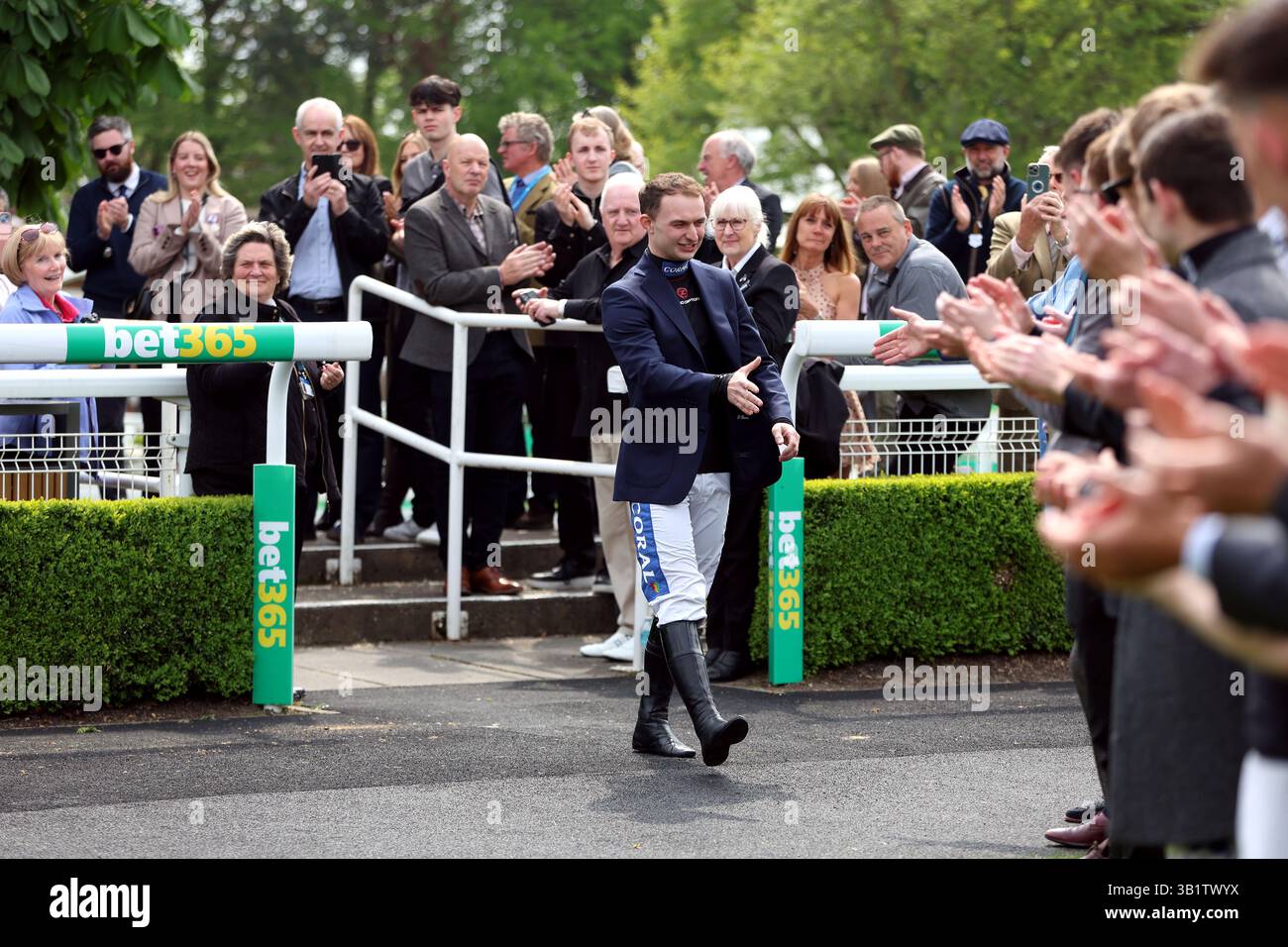 Champion Jockey Sean Bowen receives a guard of honour at Sandown Park ...