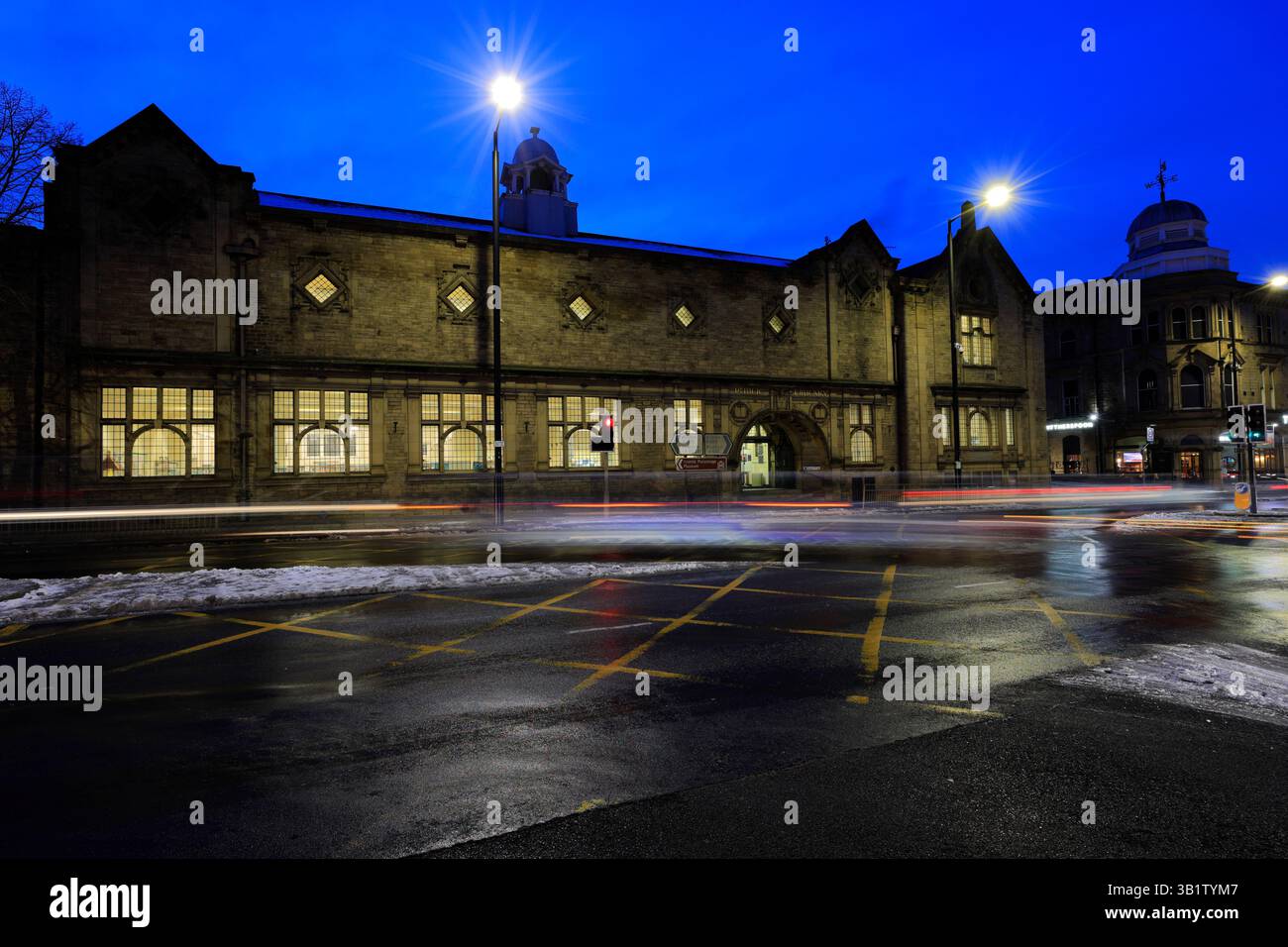 Dusk view of the public Library in Keighley town, Yorkshire, England ...