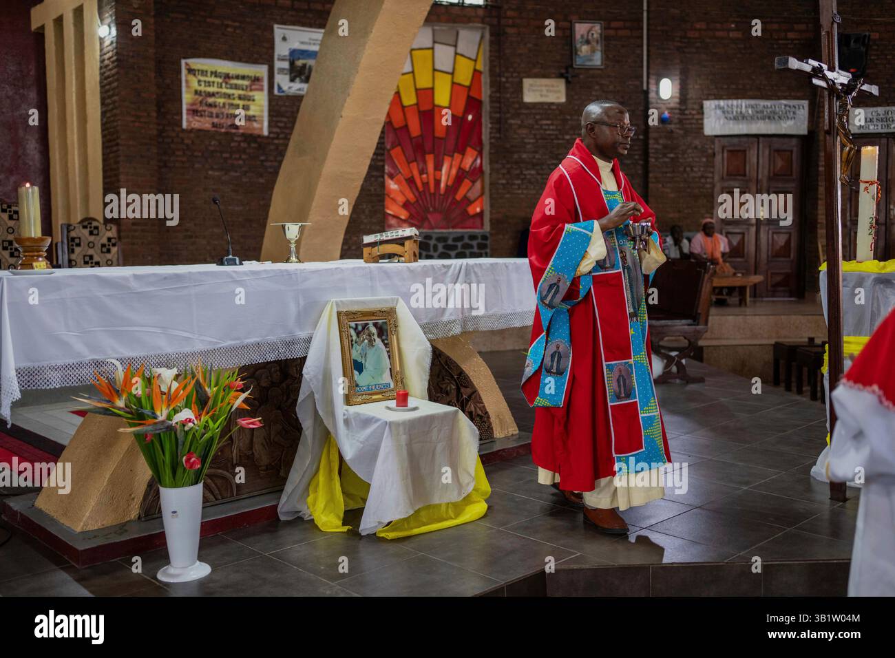 A priest attends a mass in honour of the late Pope Francis inside a ...