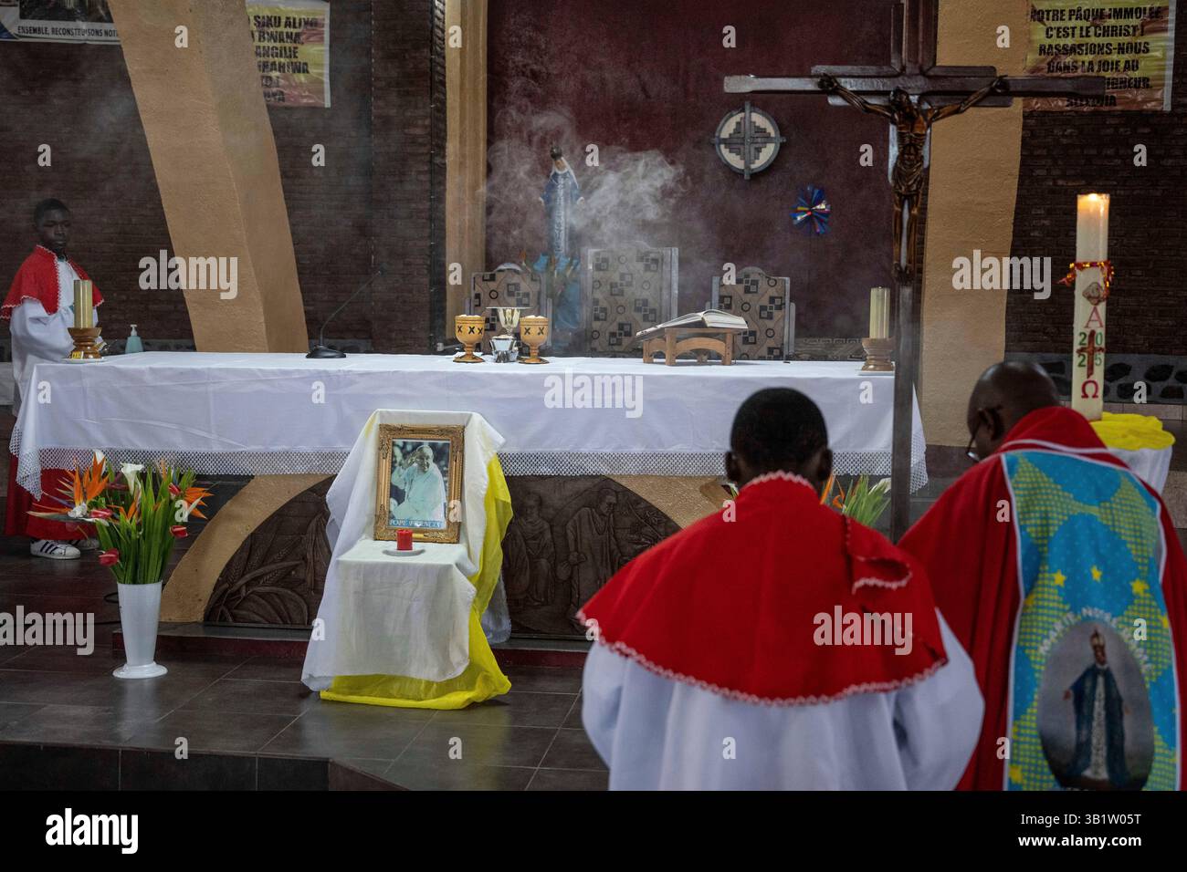 Priest attends a mass in honour of the late Pope Francis inside a ...