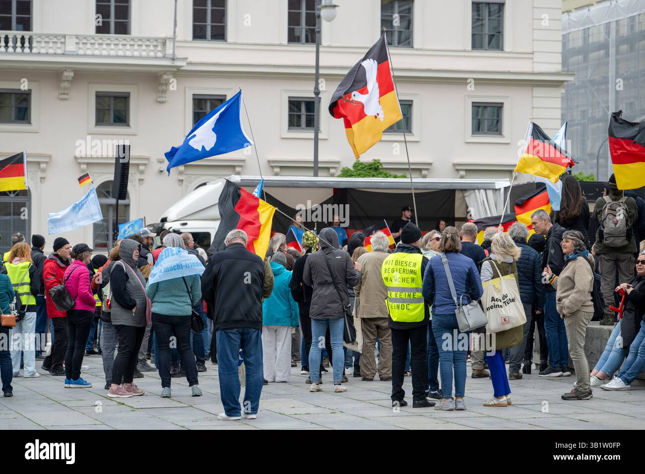 Munich, Germany. 26th Apr, 2025. People with German peace flags ...