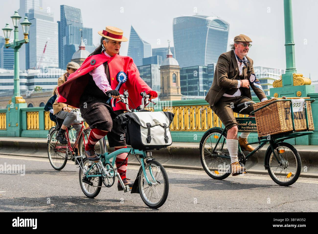 London, UK. 26th Apr, 2025. Crossing southwark bridge with the city of ...