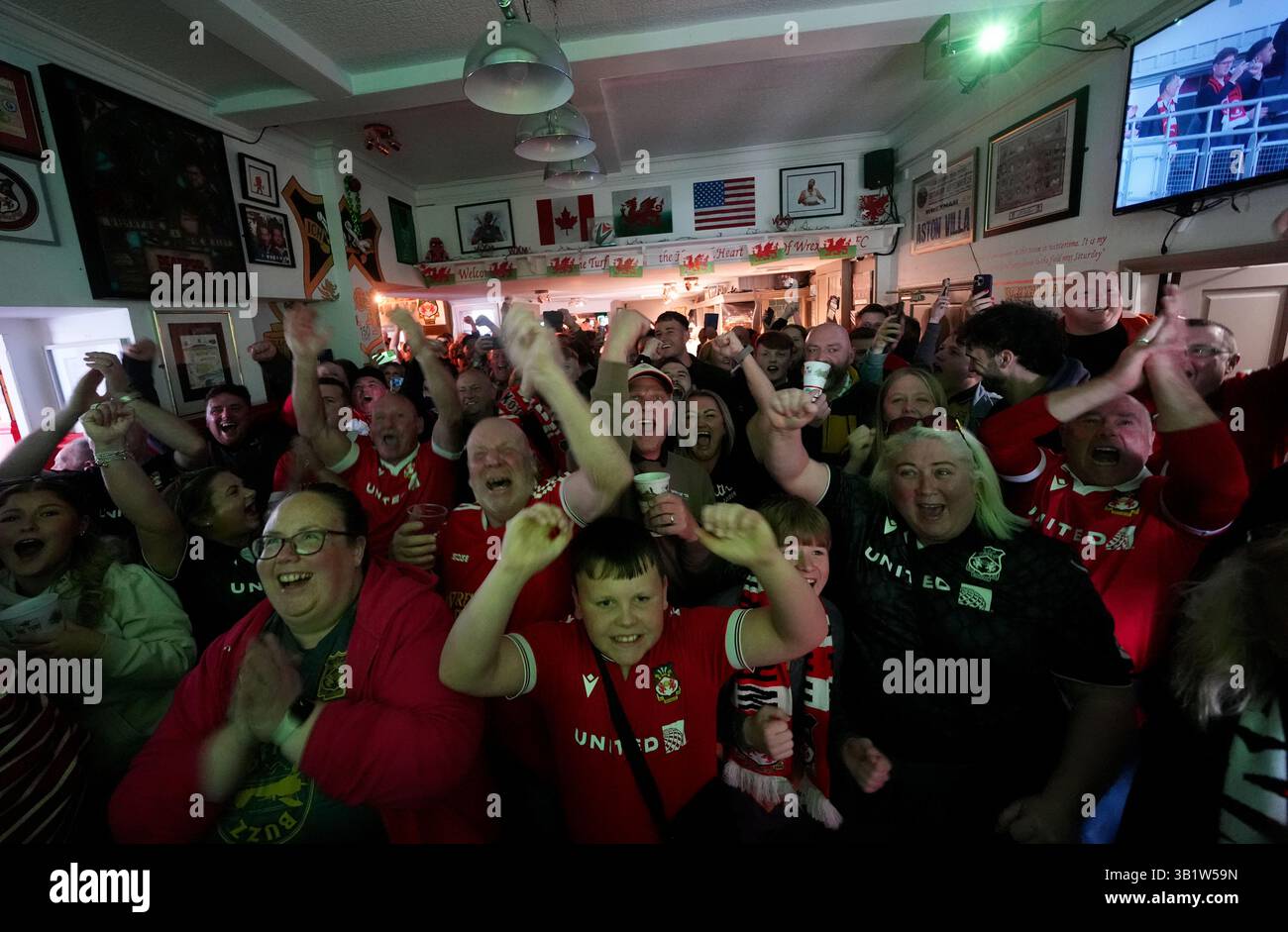 Wrexham fans in The Turf pub celebrate after Leyton Orient won against ...