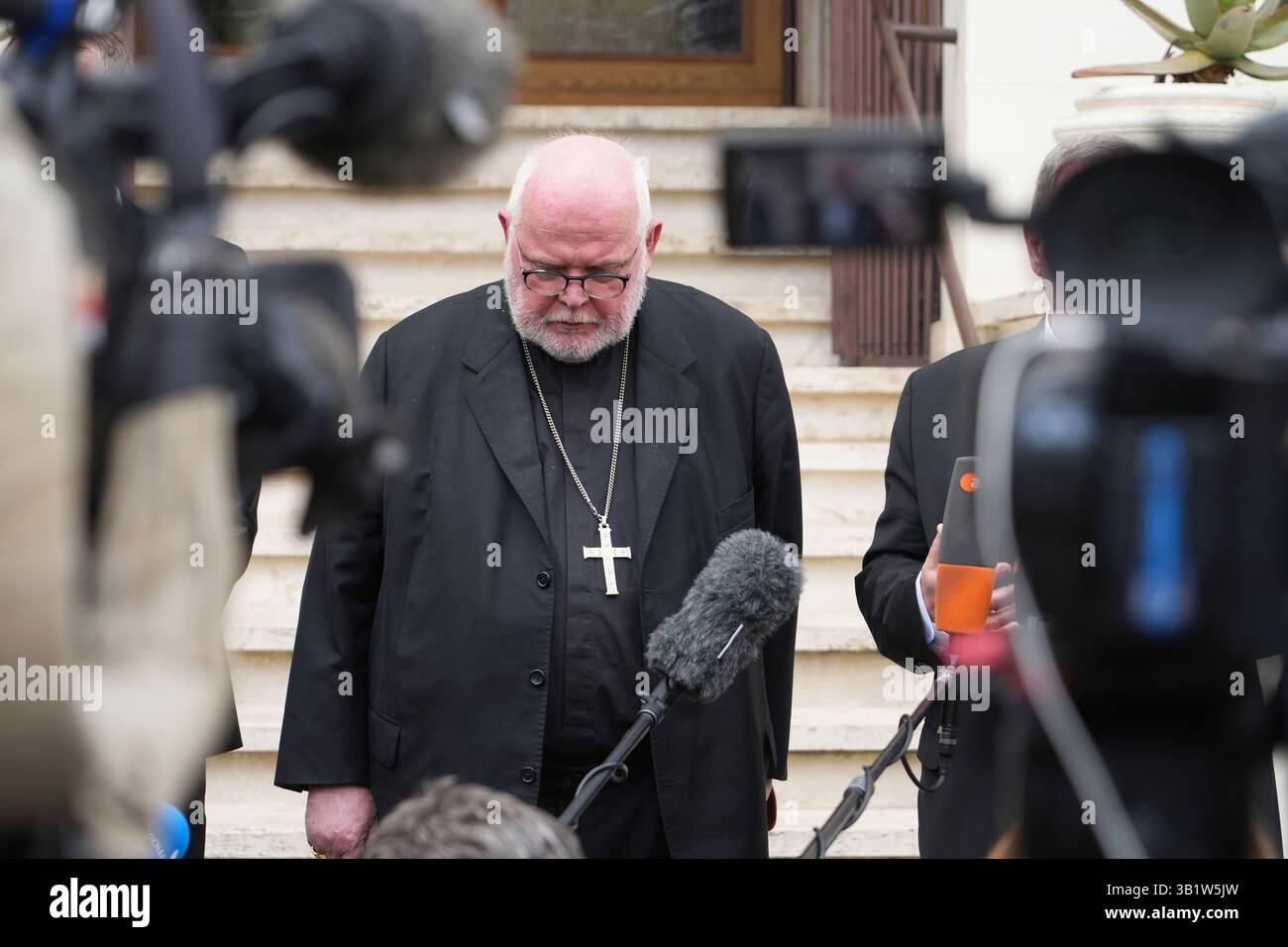 Cardinal Reinhardt Marx arrives for a news conference at the German ...