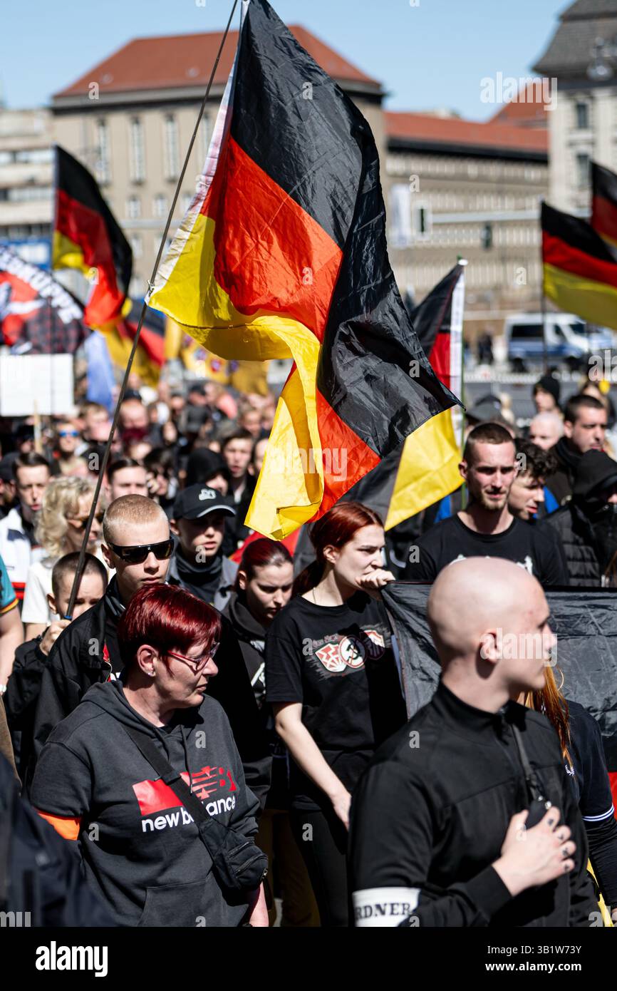 26 April 2025, Berlin: People with German flags take part in the ...