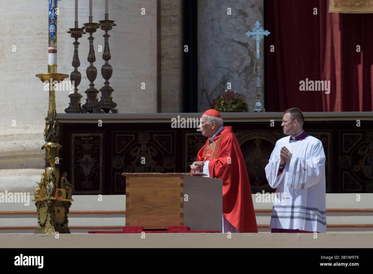 Cardinal Giovanni Battista Re blesses the coffin during the funeral of ...