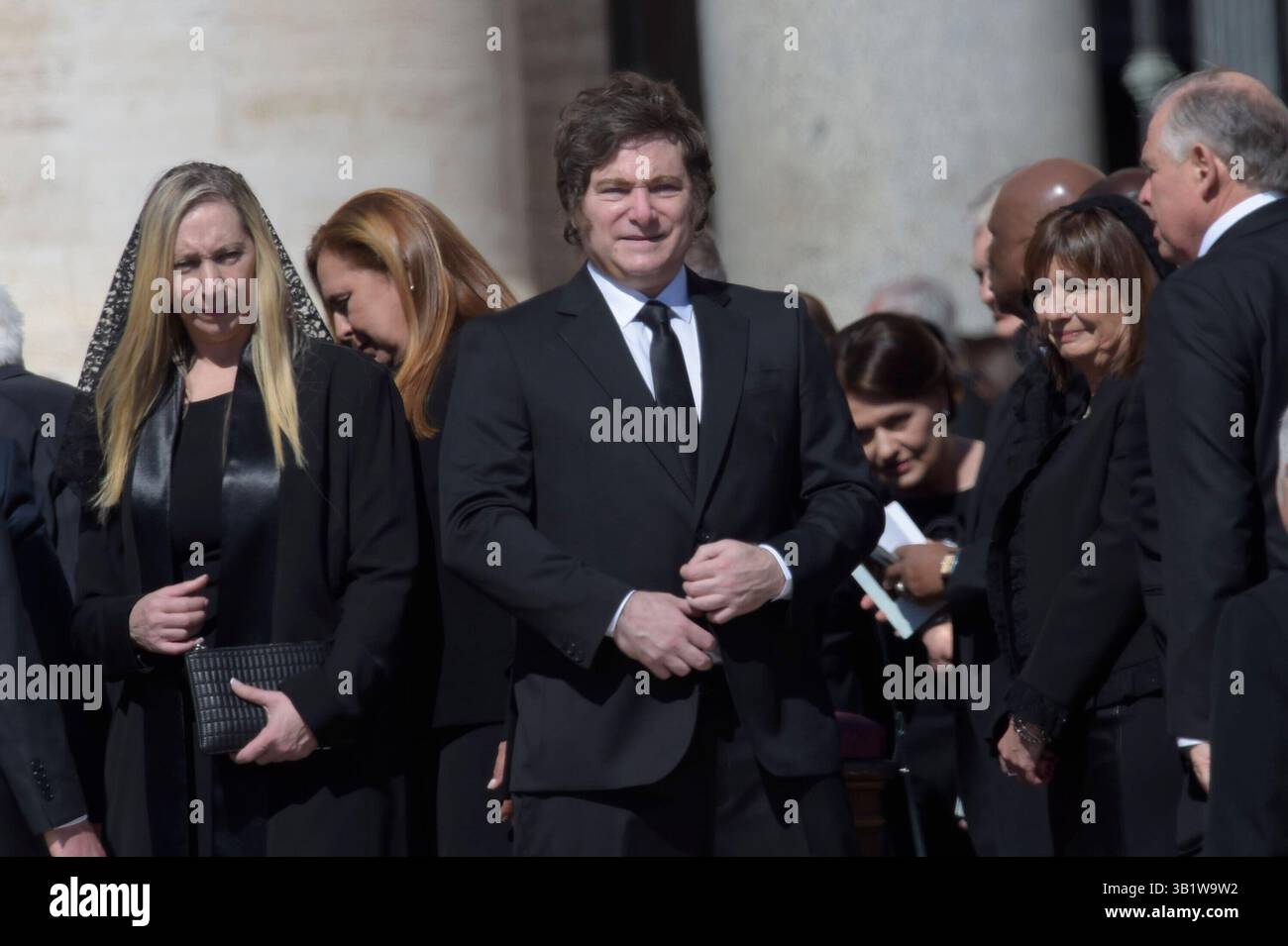 Cardinal Giovanni Battista Re blesses the coffin during the funeral of ...