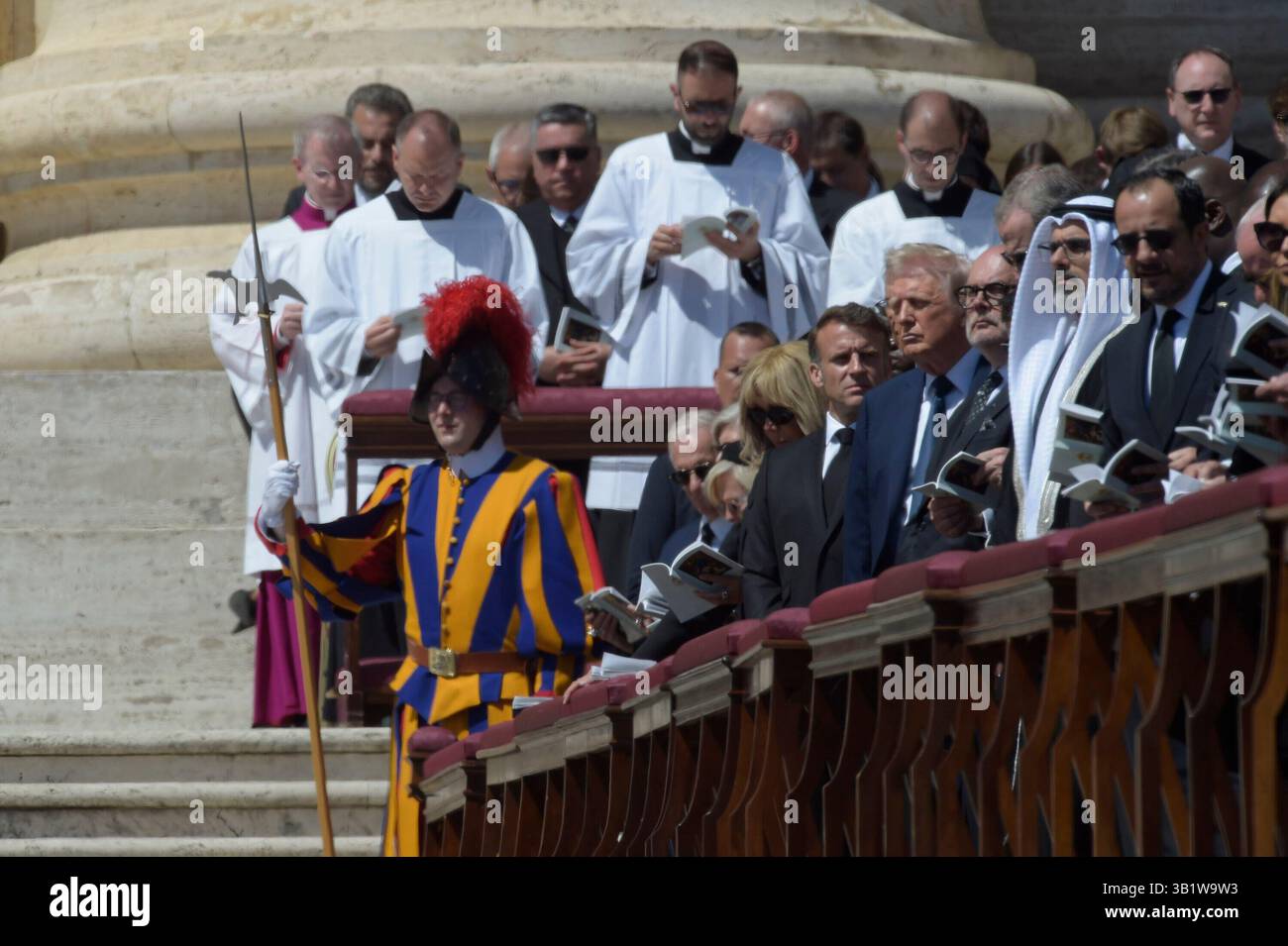 Cardinal Giovanni Battista Re blesses the coffin during the funeral of ...