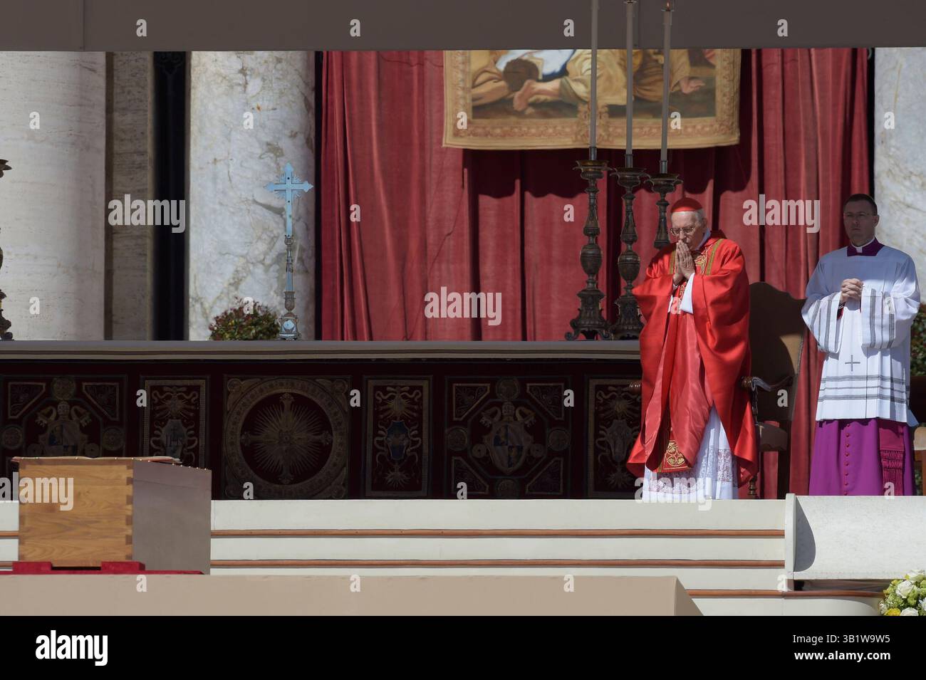 Cardinal Giovanni Battista Re blesses the coffin during the funeral of ...