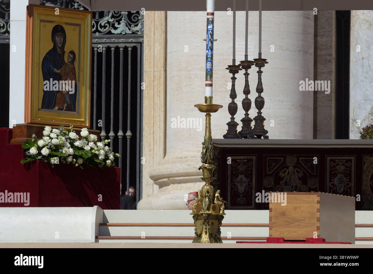 Cardinal Giovanni Battista Re blesses the coffin during the funeral of ...