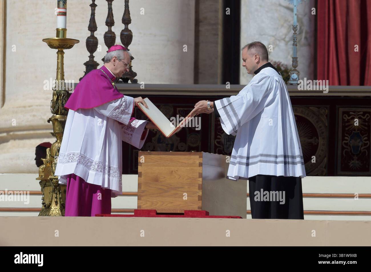 Cardinal Giovanni Battista Re blesses the coffin during the funeral of ...