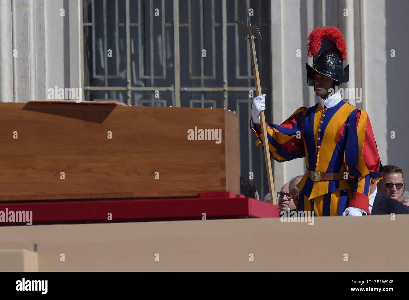 Cardinal Giovanni Battista Re blesses the coffin during the funeral of ...