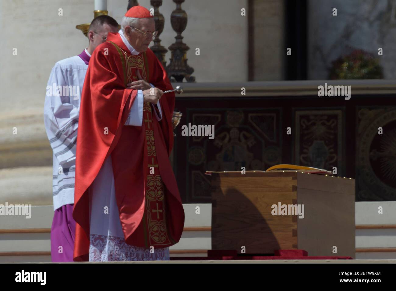 Cardinal Giovanni Battista Re blesses the coffin during the funeral of ...