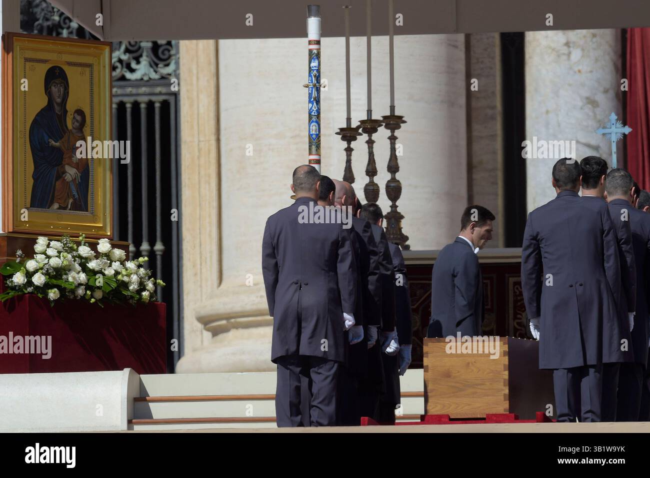 Cardinal Giovanni Battista Re blesses the coffin during the funeral of ...