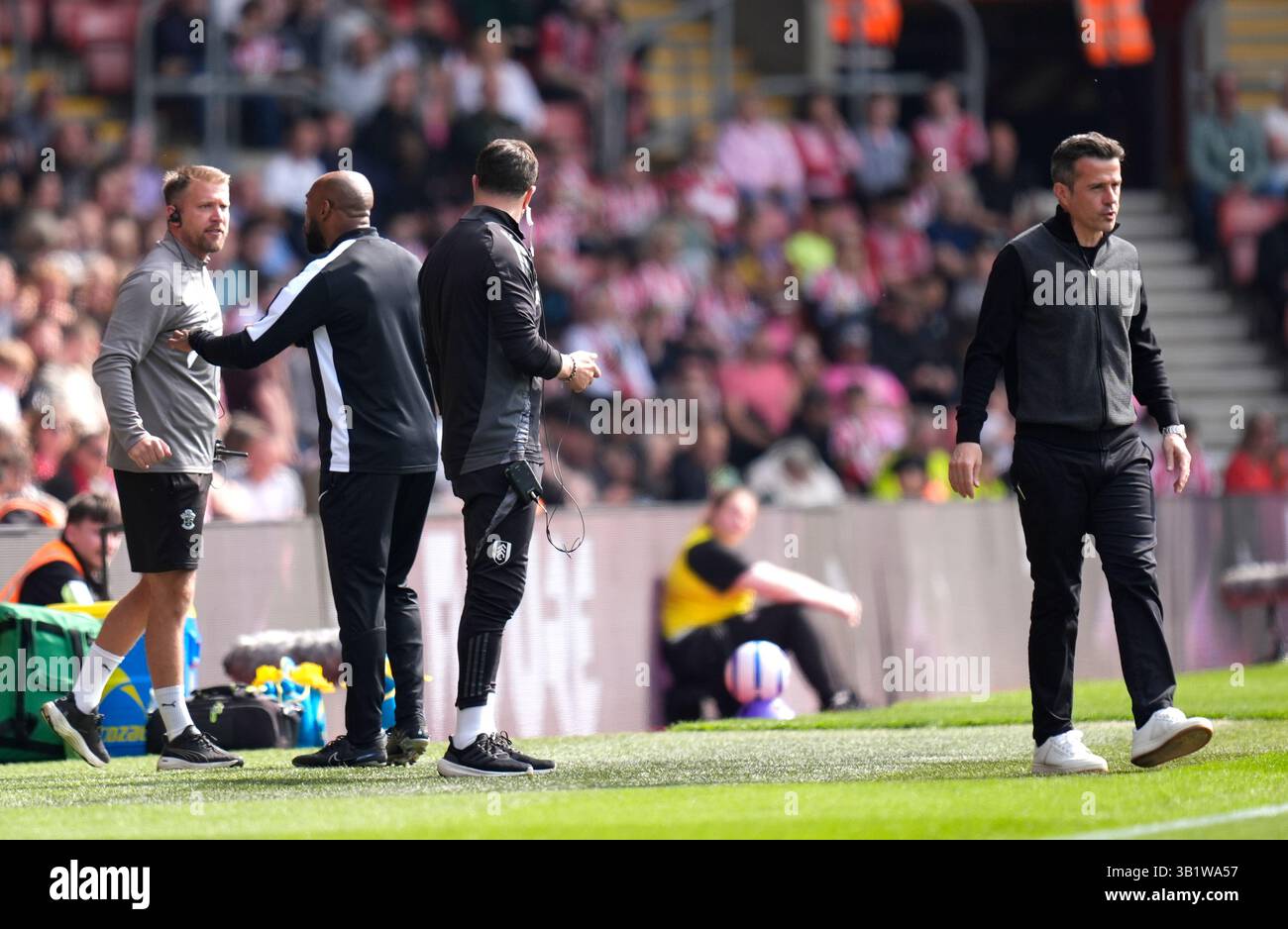 Fourth official Sam Allison (centre) speaks with Southampton ...