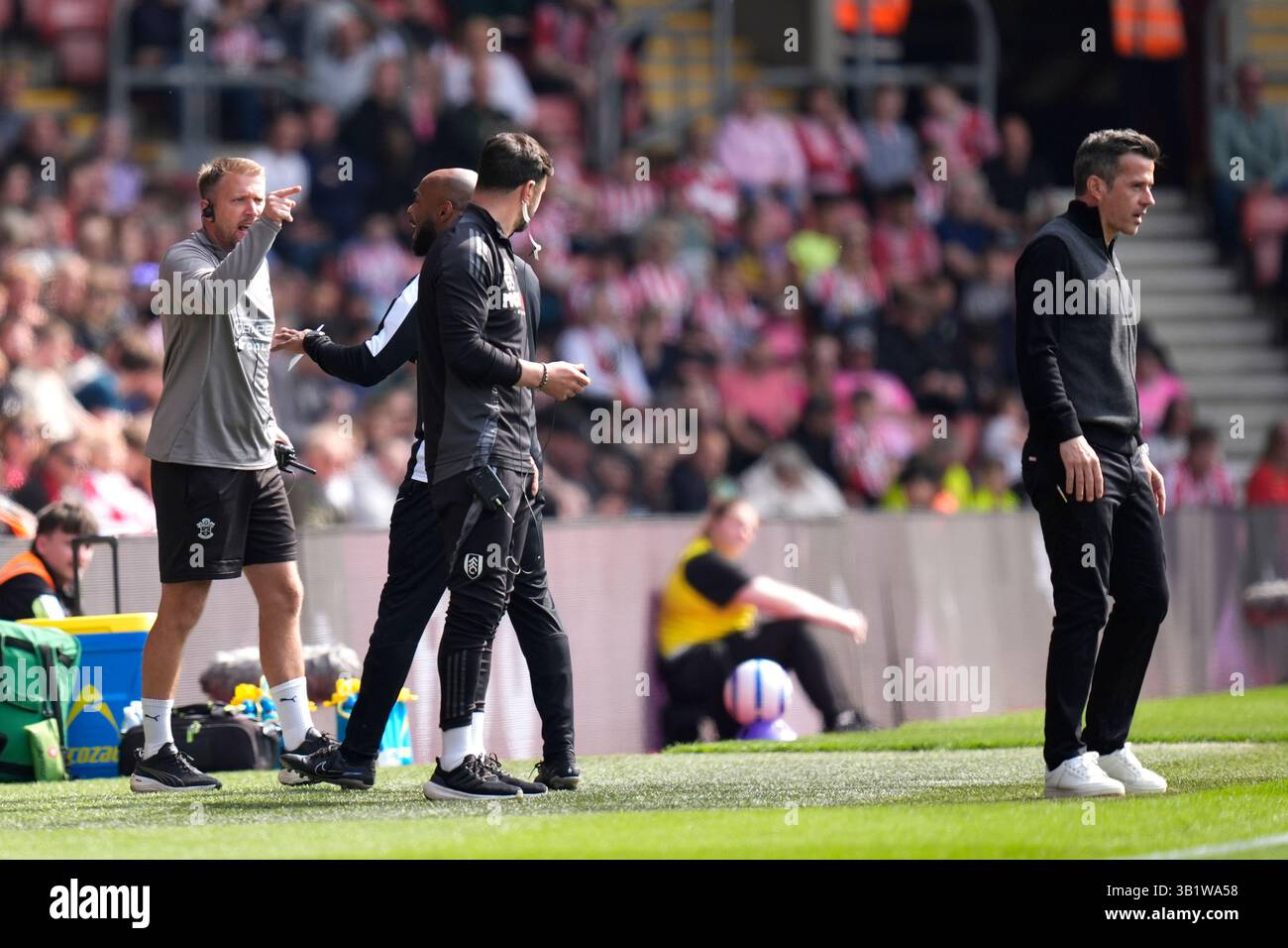 Fourth official Sam Allison (centre) speaks with Southampton ...
