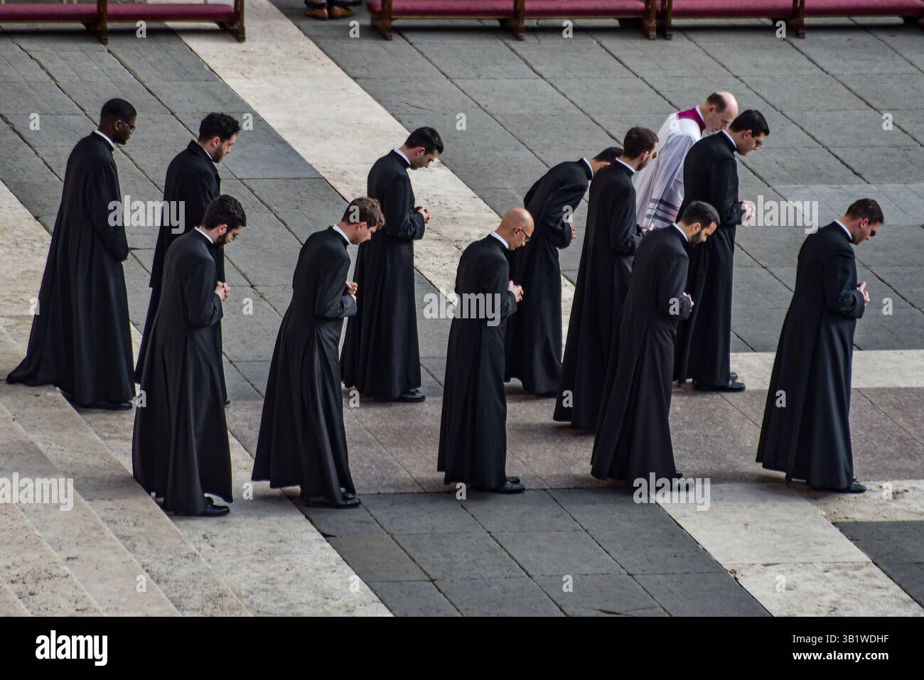 A group of priests arrive at St. Peter's Square for the funeral ...