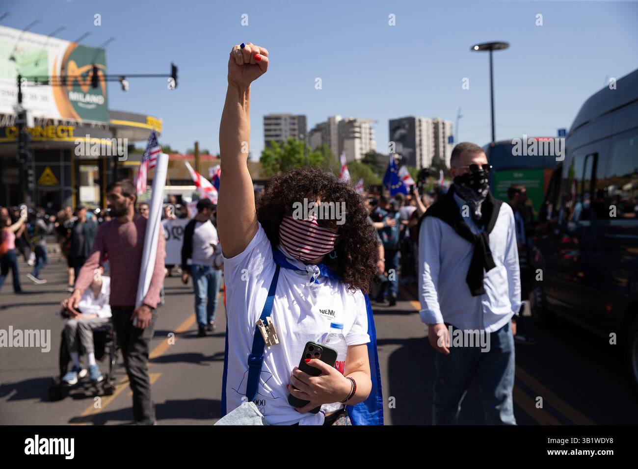 Tbilisi, Tbilisi, Georgia. 26th Apr, 2025. A masked protester raises ...