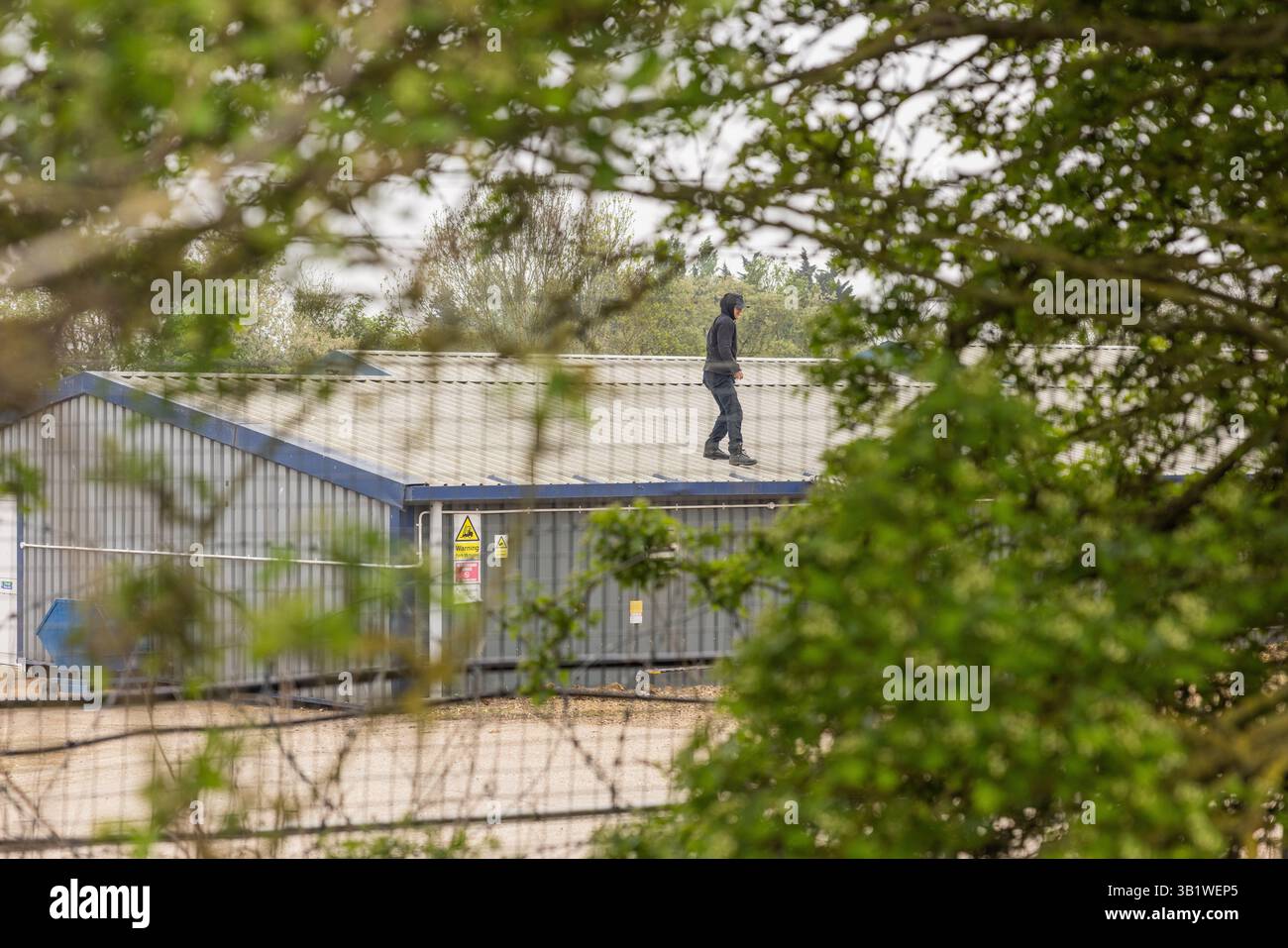 Huntingdon, UK. 26 APR, 2025. Activists gain access to the roof during ...