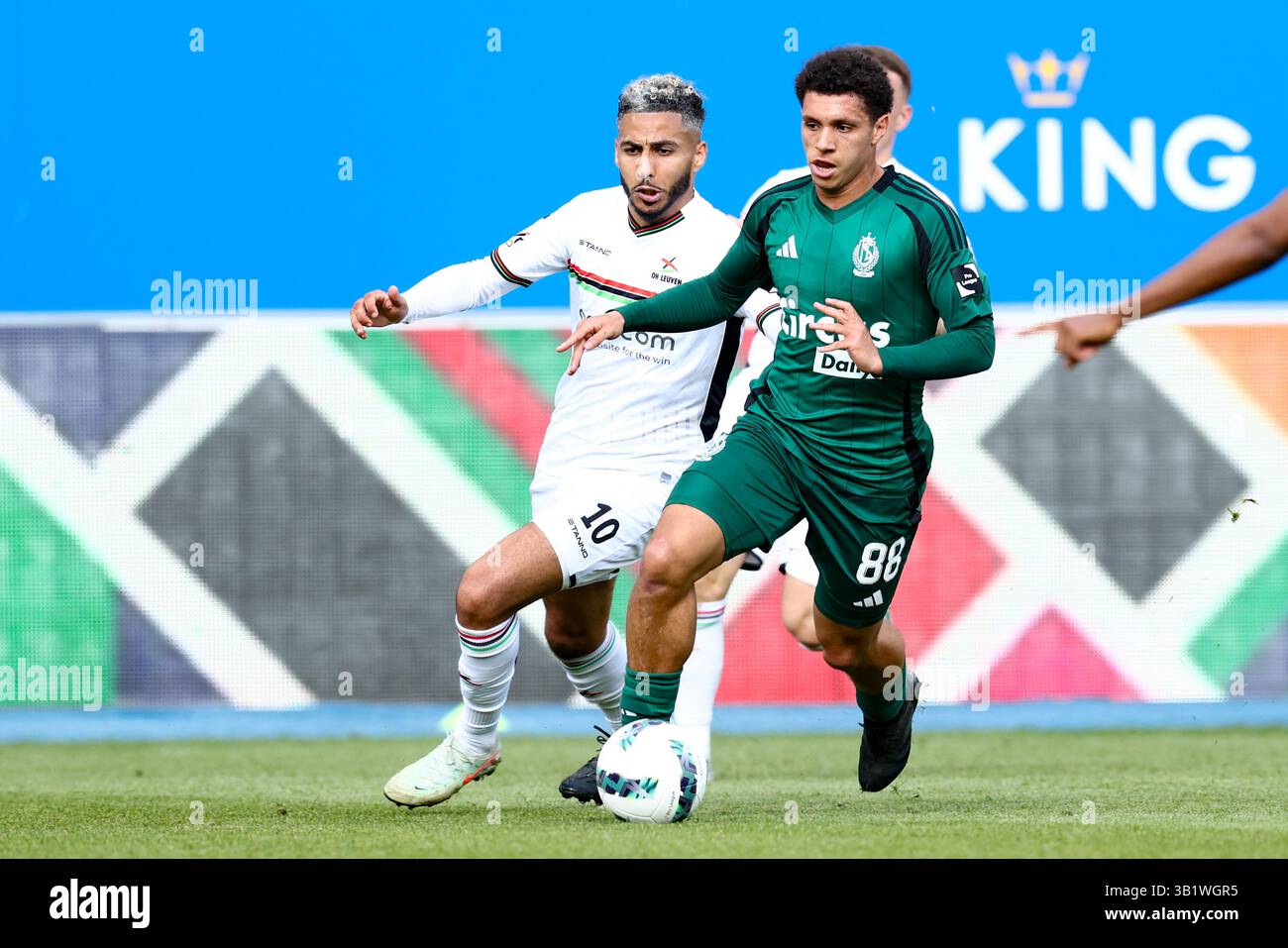Leuven, Belgium. 26th Apr, 2025. OHL's Youssef Maziz and Standard's Henry Lawrence fight for the ...