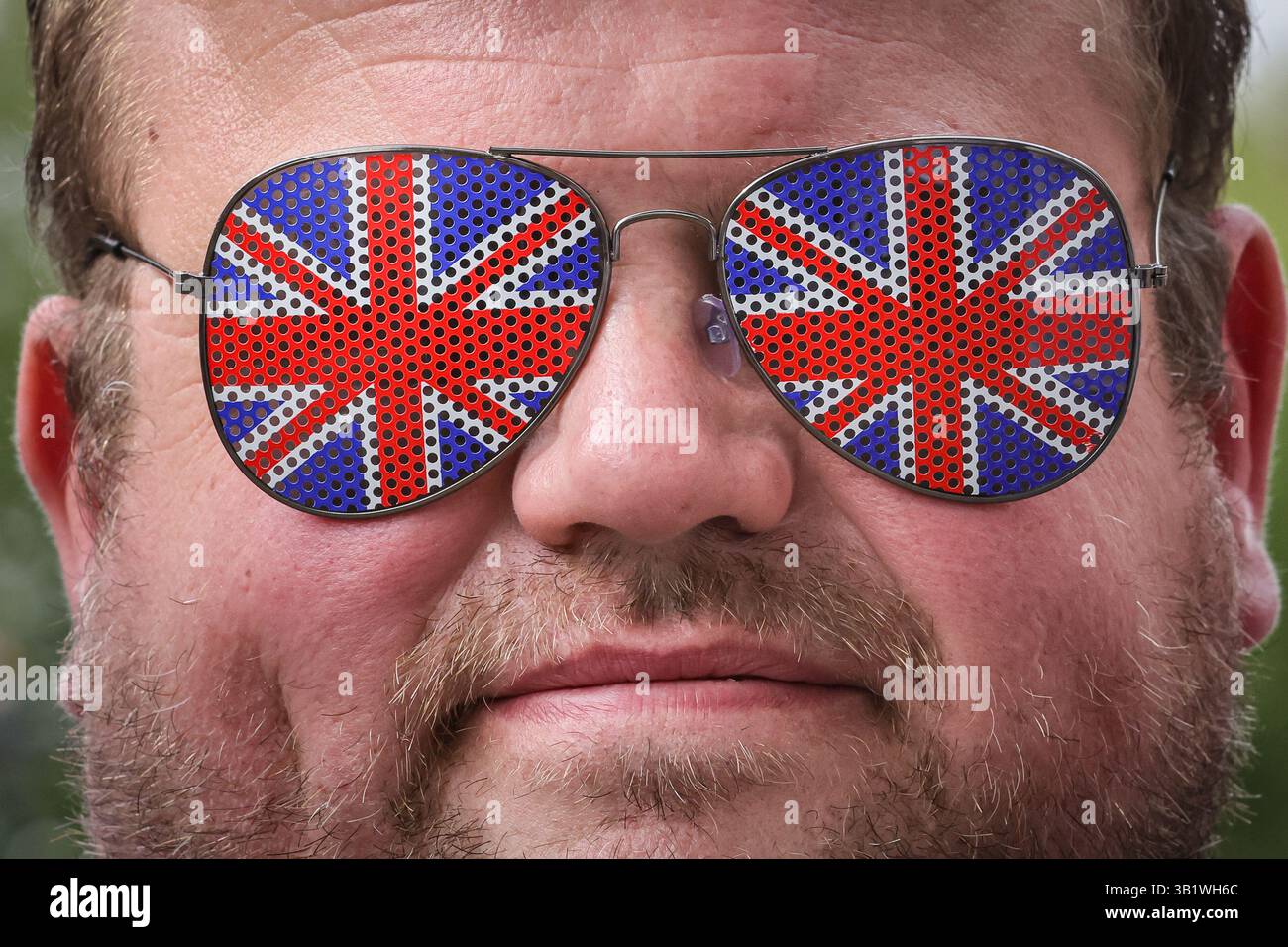 London, UK. 26th Apr, 2025. A crowd of spectators decked out with ...