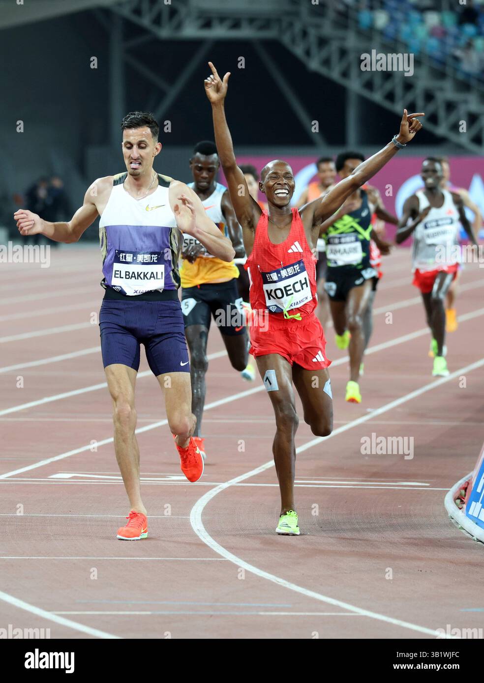 Simon Kiprop KOECH of Kenya, right, celebrates after finishing the ...