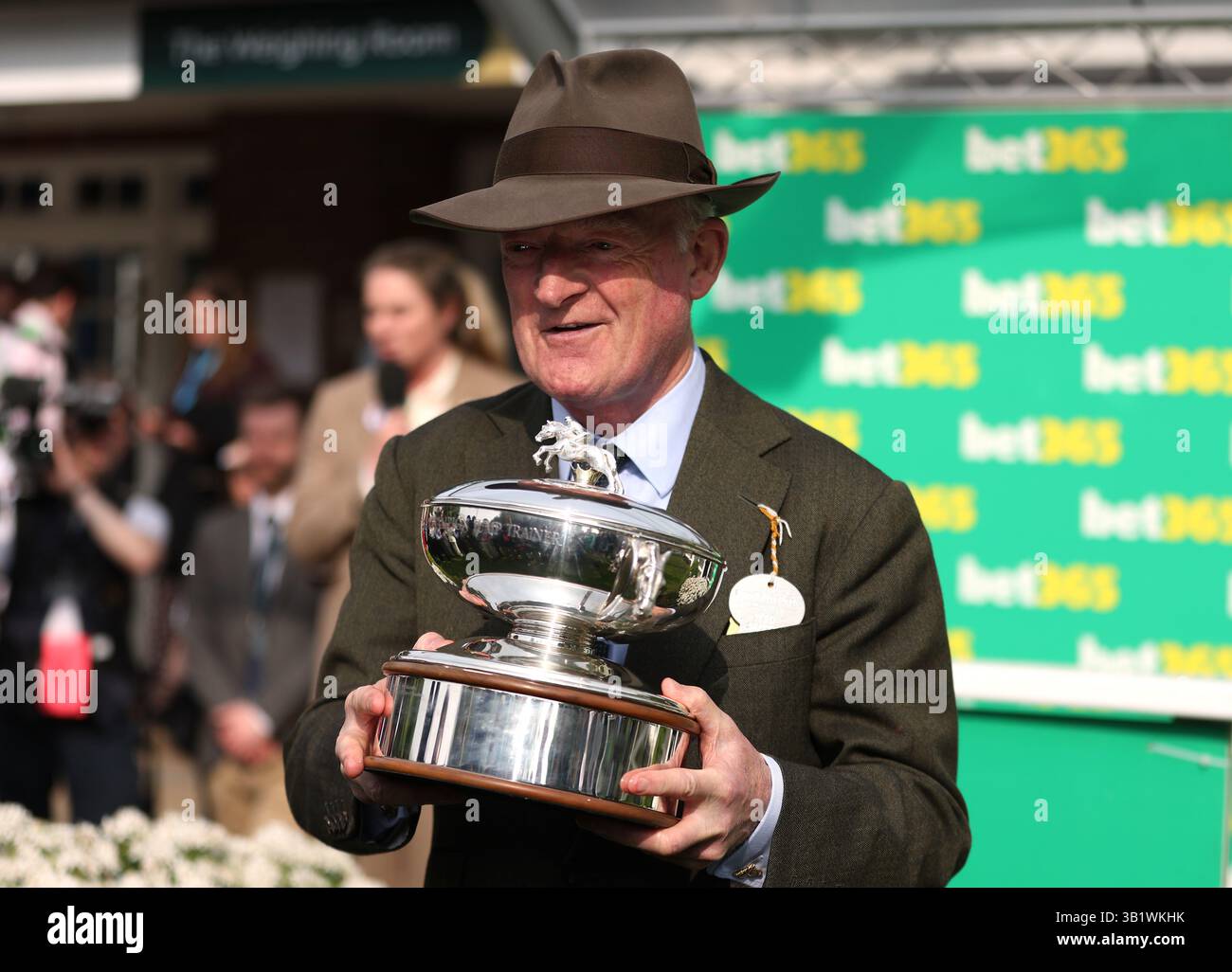 Trainer Willie Mullins with the Champion Jump trainer trophy at Sandown ...