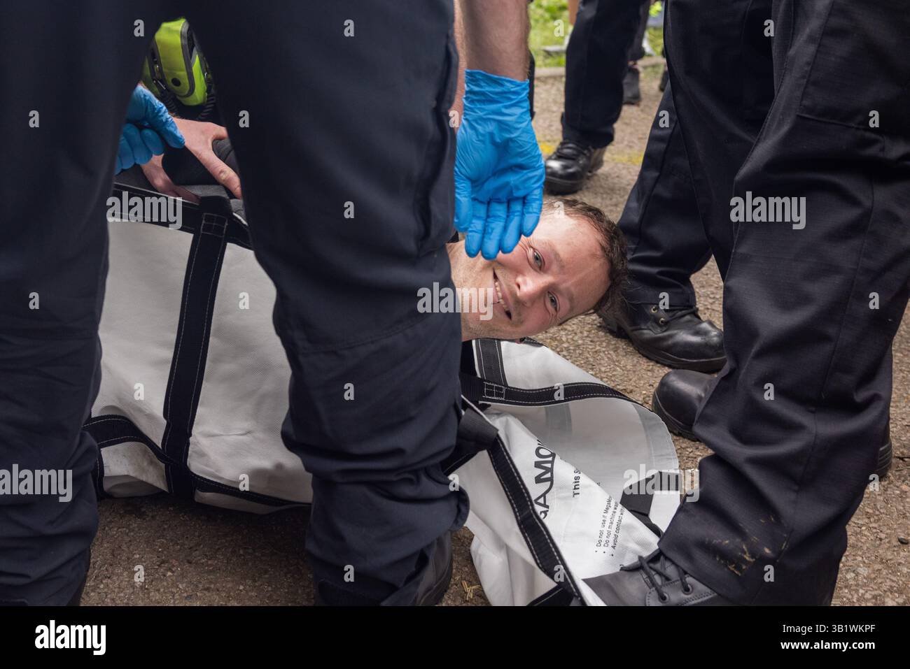 Huntingdon, UK. 26 APR, 2025. Man smiles as he is arrested and detained ...